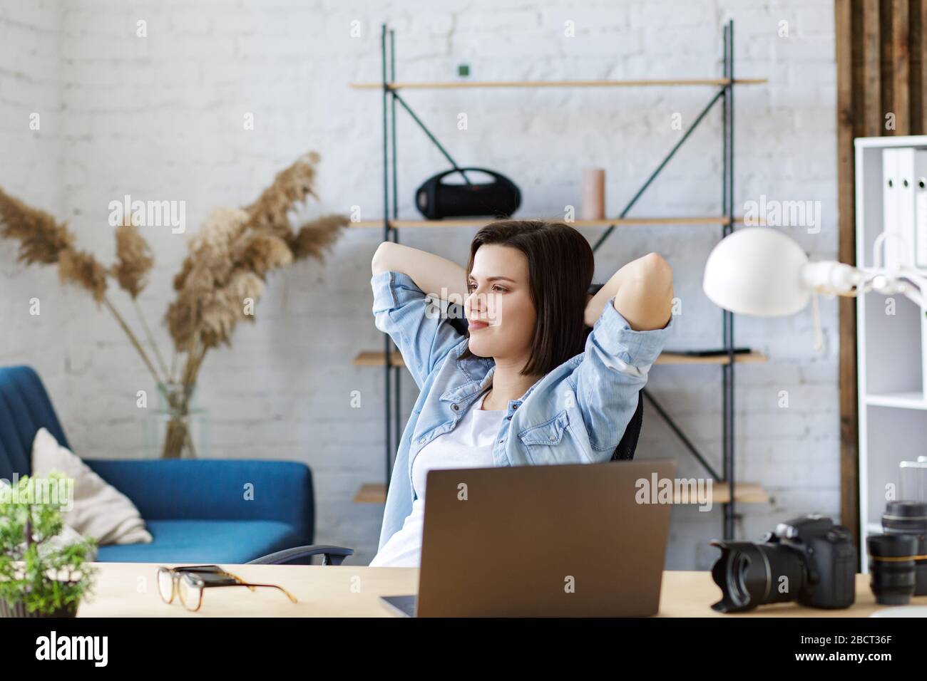 Working from home. Portrait of smiling female freelancer with laptop ...