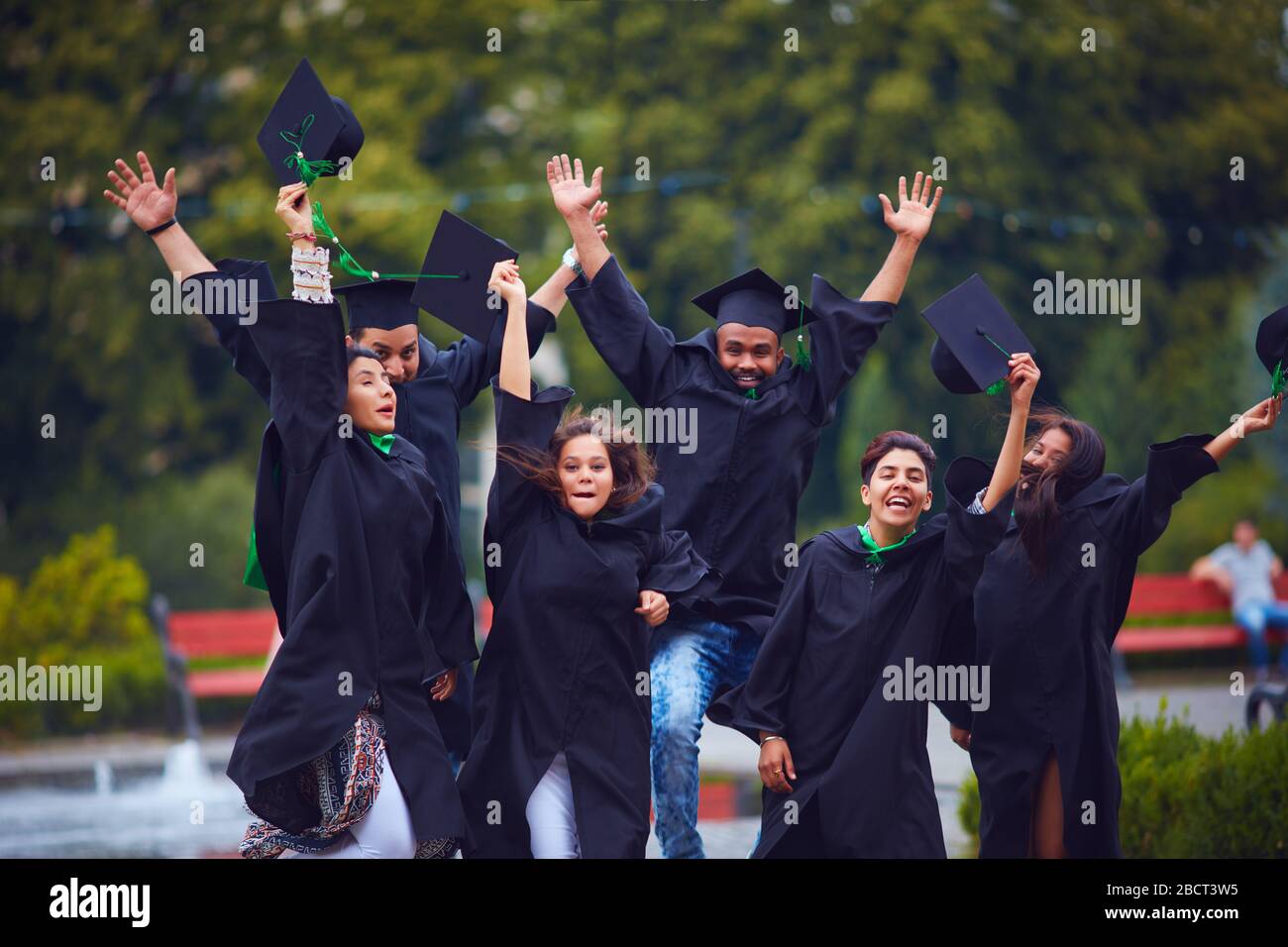 group of happy indian students celebrating the college graduation ...