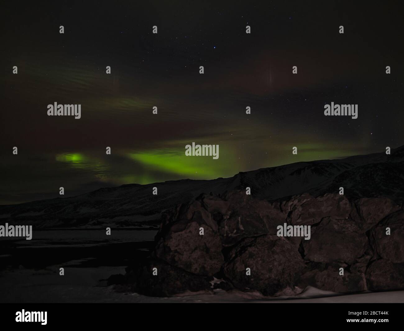 Stars and green northern lights in Iceland above the clouds Stock Photo ...