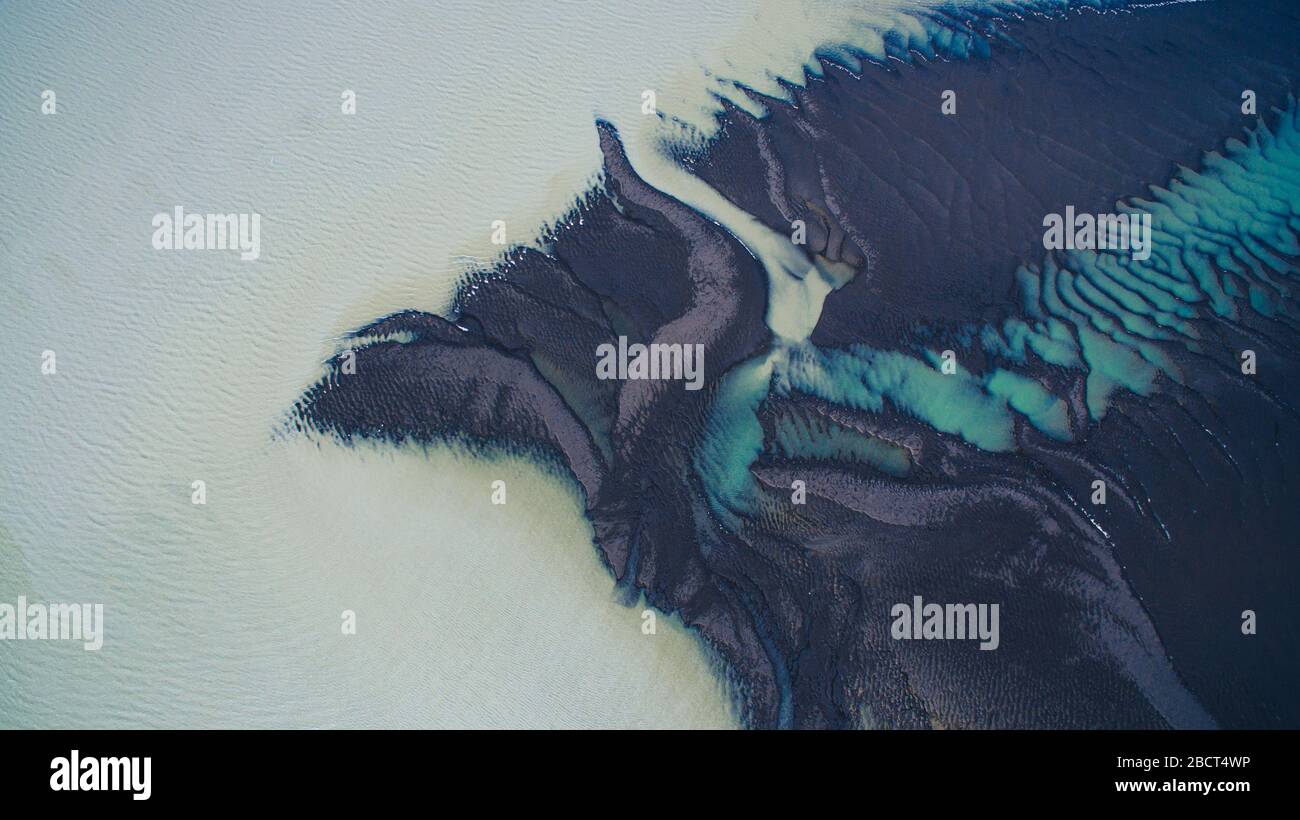 Blue river delta flowing into the pond. Top view. Aerial photography ...