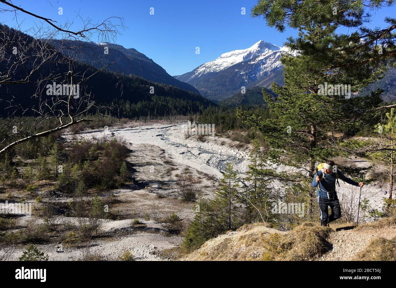 Griesen, Germany. 05th Apr, 2020. A hiker walks on a path above the ...