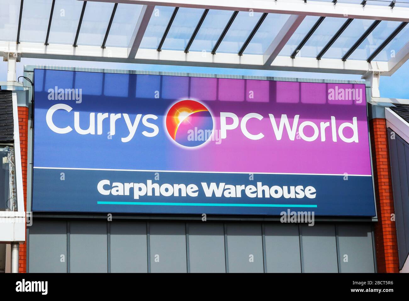 Overhead logo signboard outside a store for Currys PC World and ...