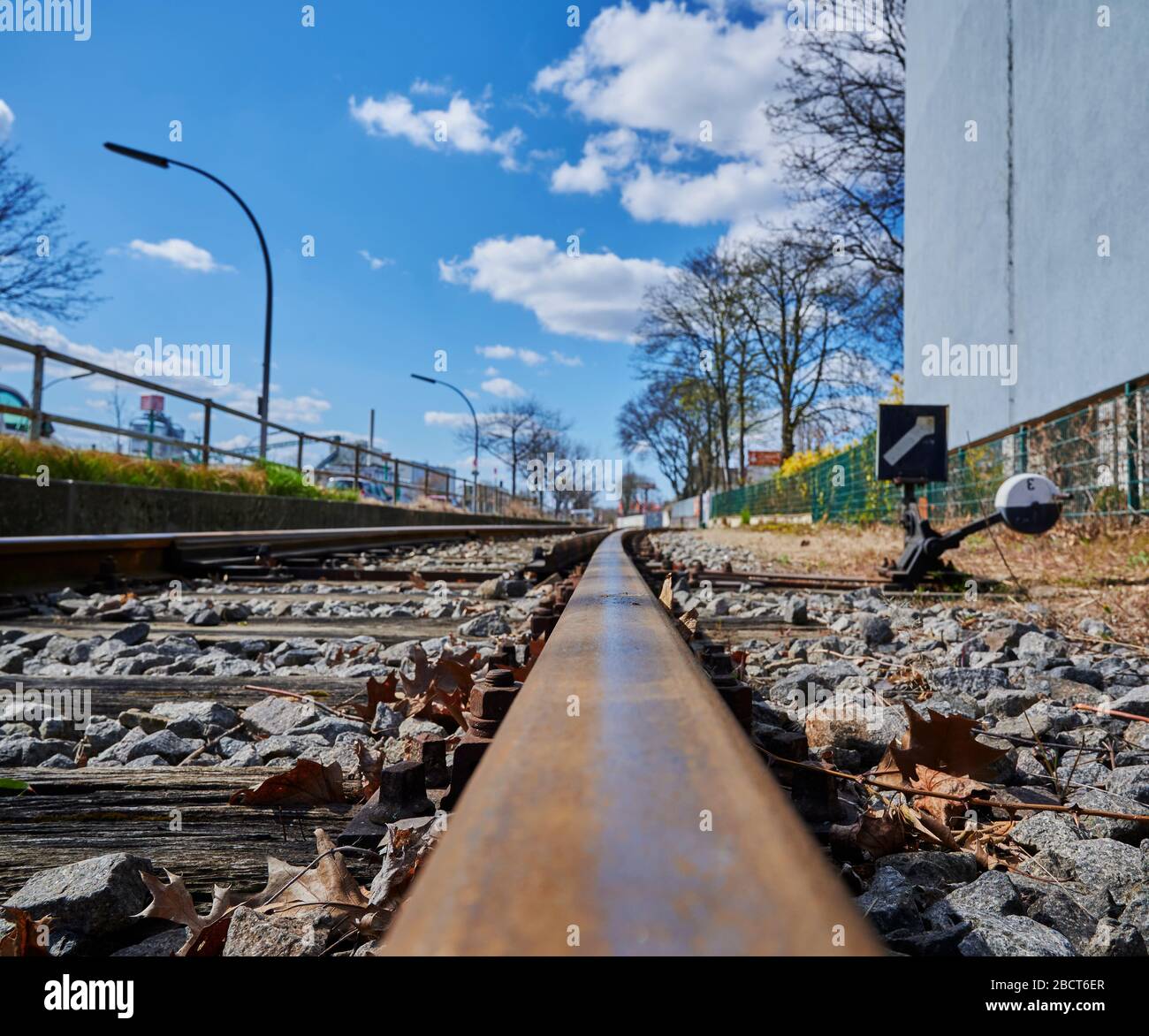 Low angle shot along a railroad track of a railroad line for freight ...