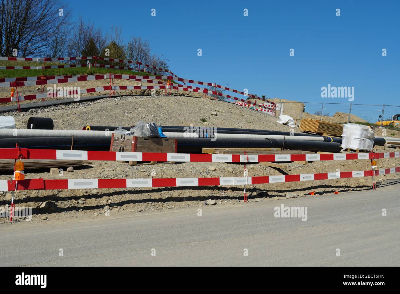 horizontal Barrier planks of red and white colors along the street side ...