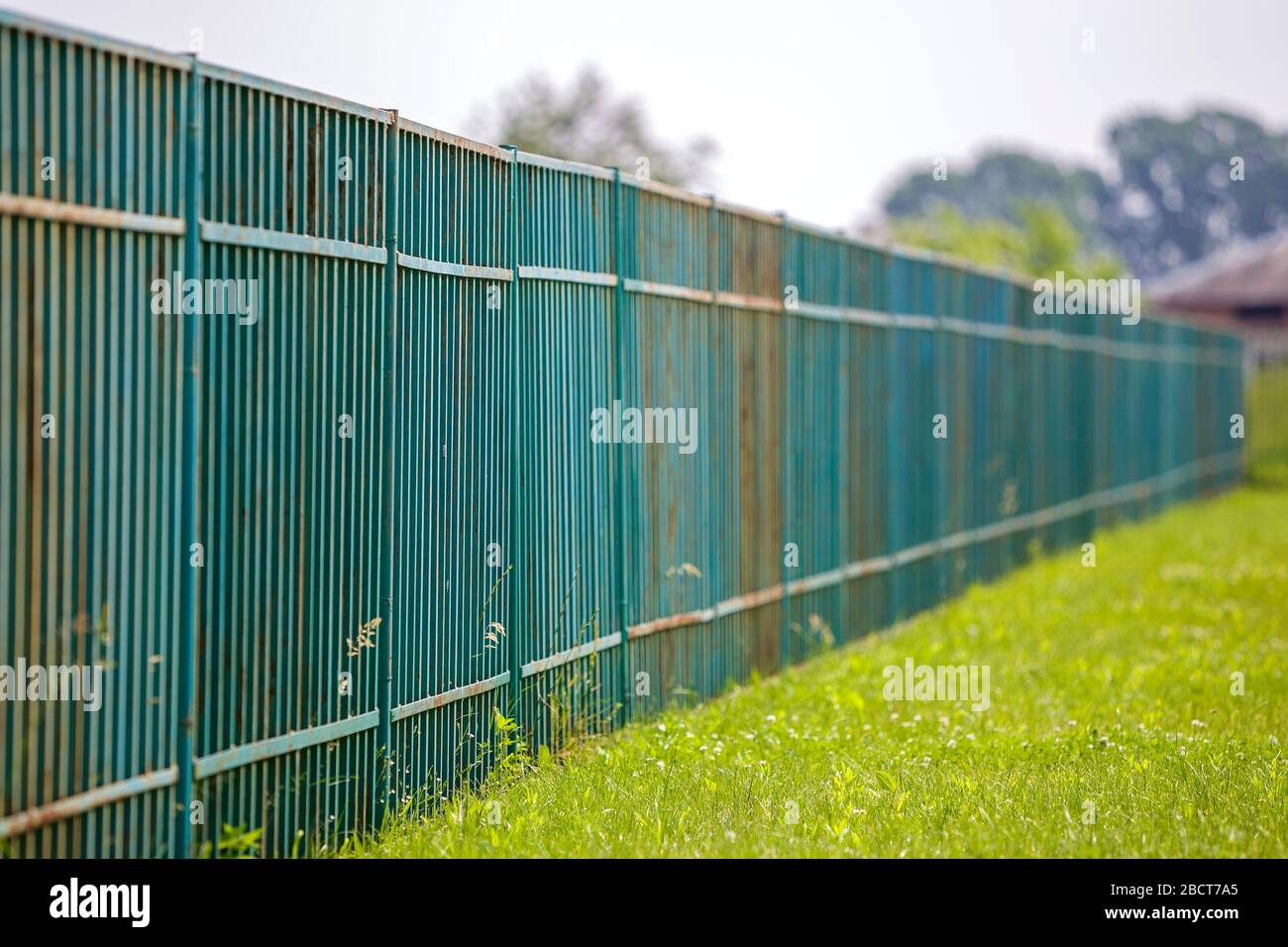Long rusty old metalic fence Stock Photo - Alamy