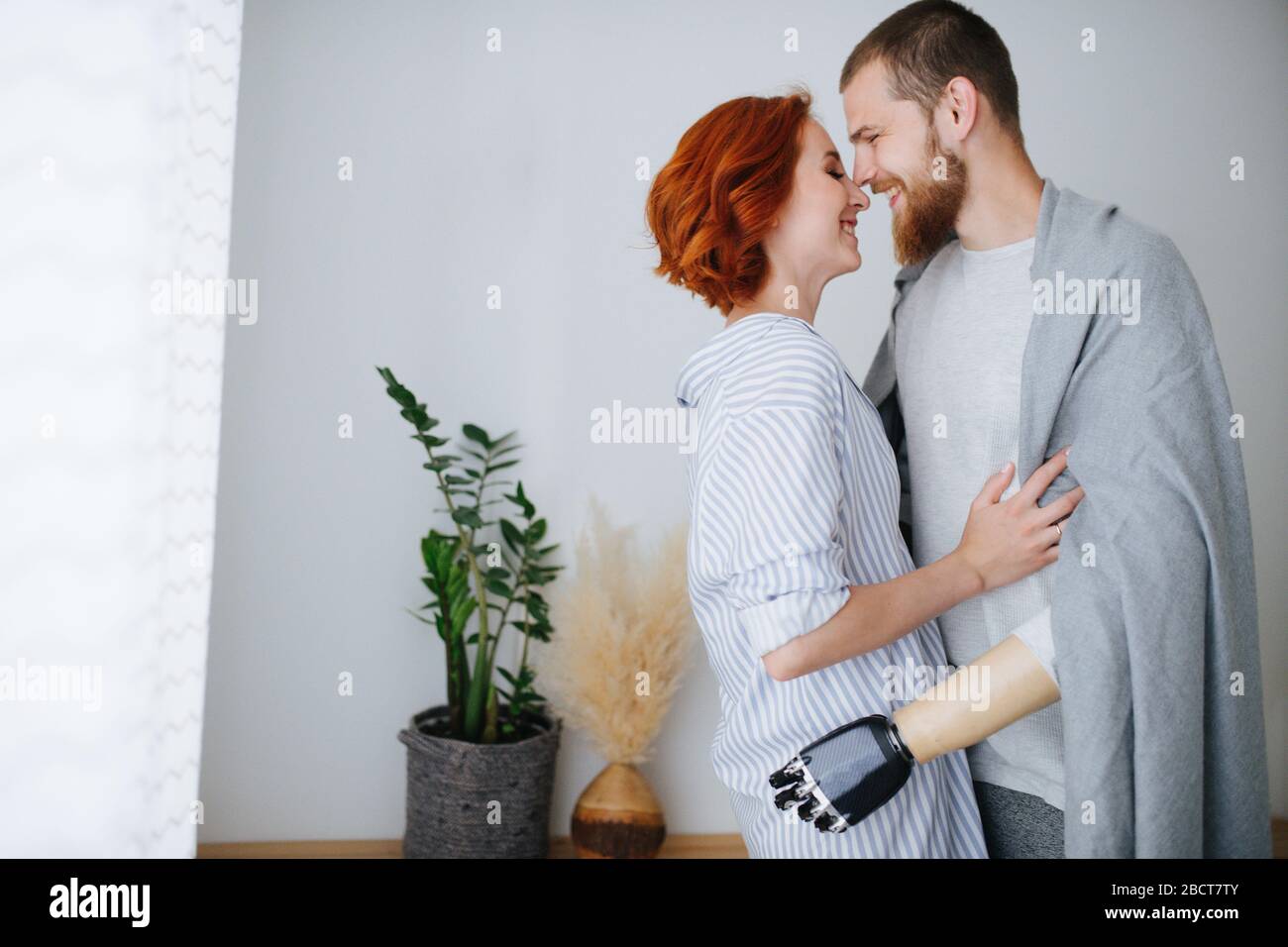 Happy married couple in love at home, standing close, feeling each ...