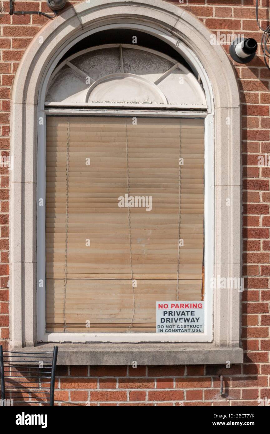 a close up view of a bay window with the shutters closed Stock Photo ...