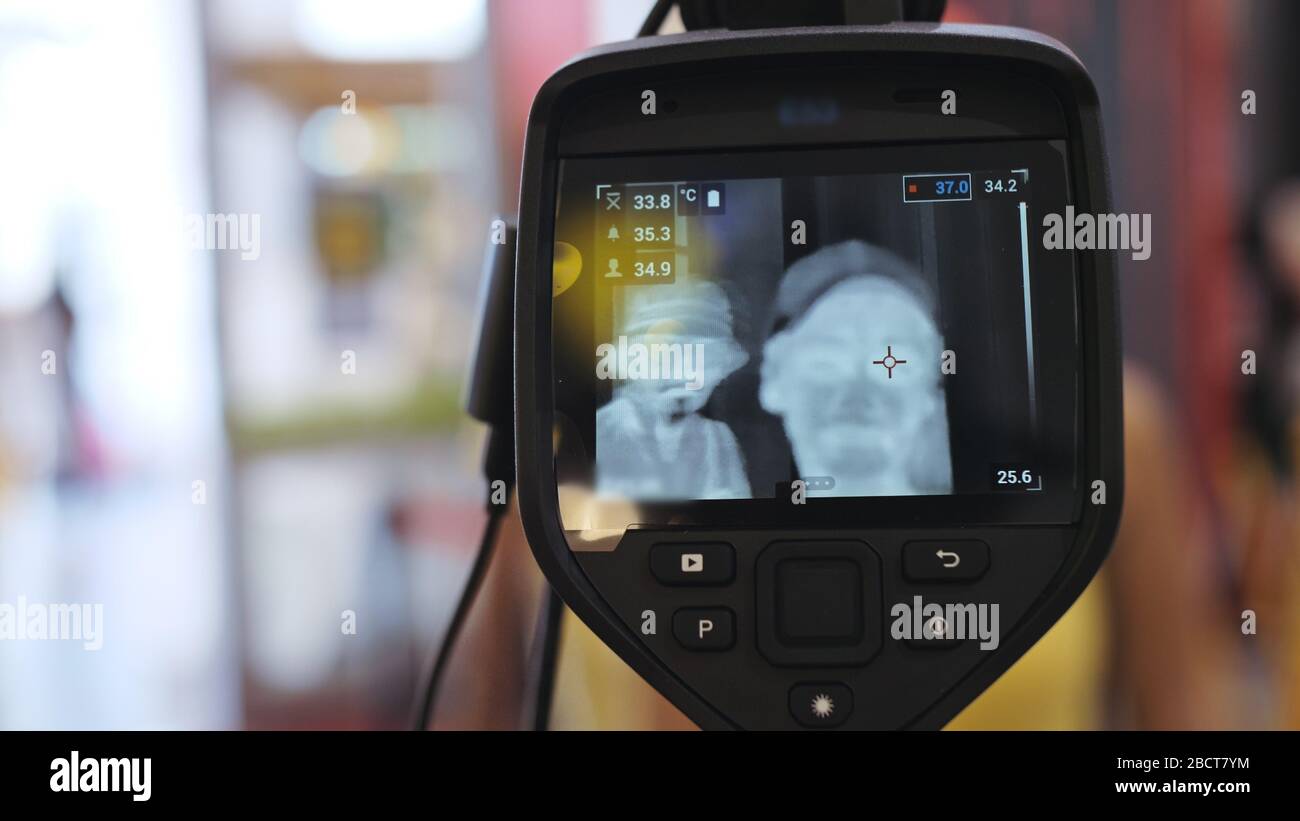 Temperature check at a supermarket, grocery store with a thermal ...