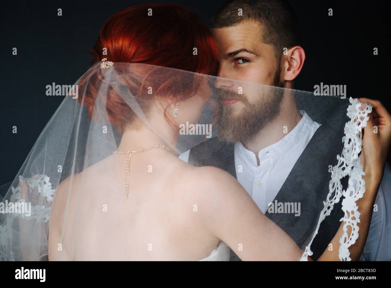 Bride and groom standing closely together face to face Stock Photo - Alamy