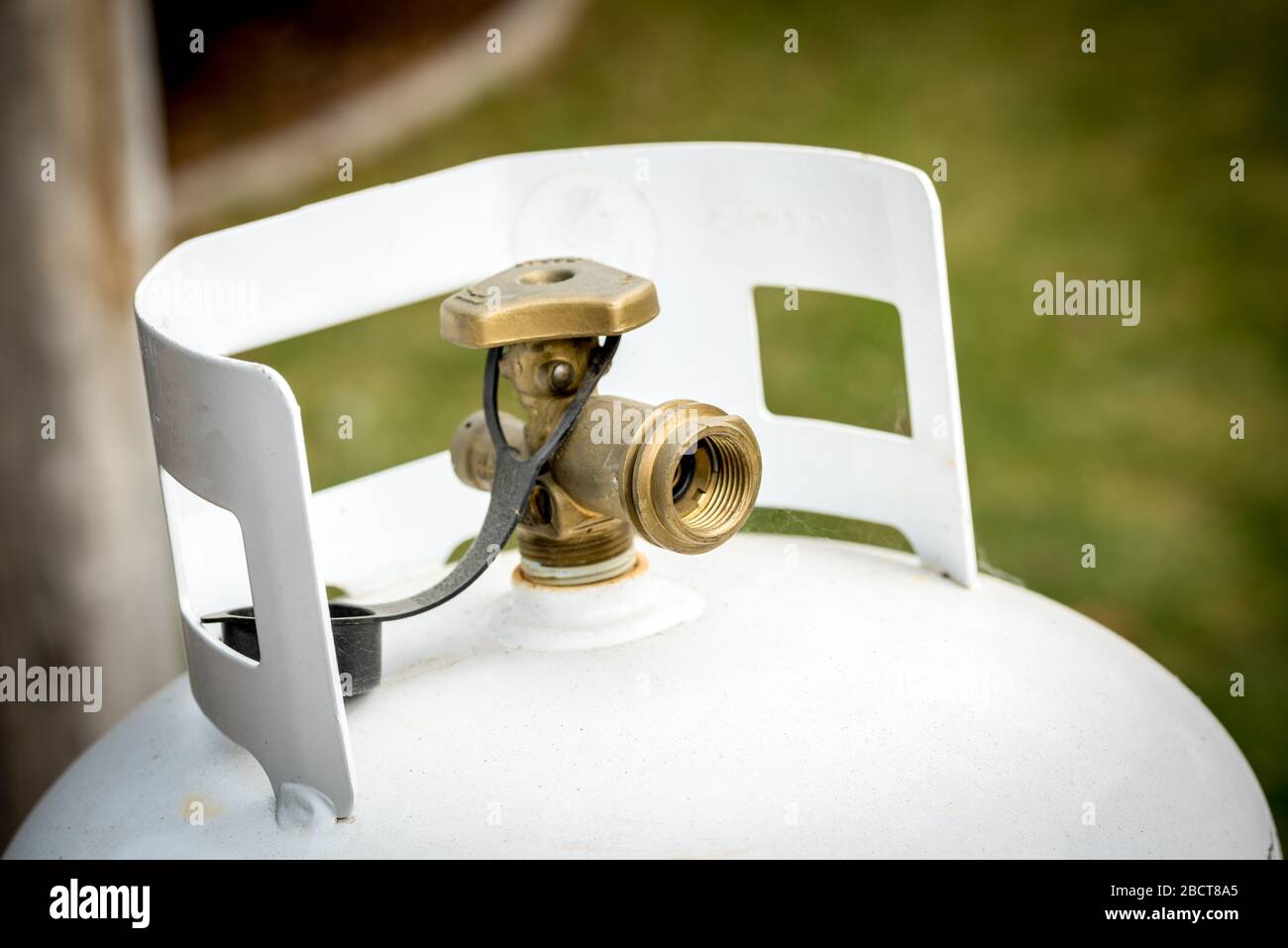 Small take holding propane used for a family grill Stock Photo - Alamy
