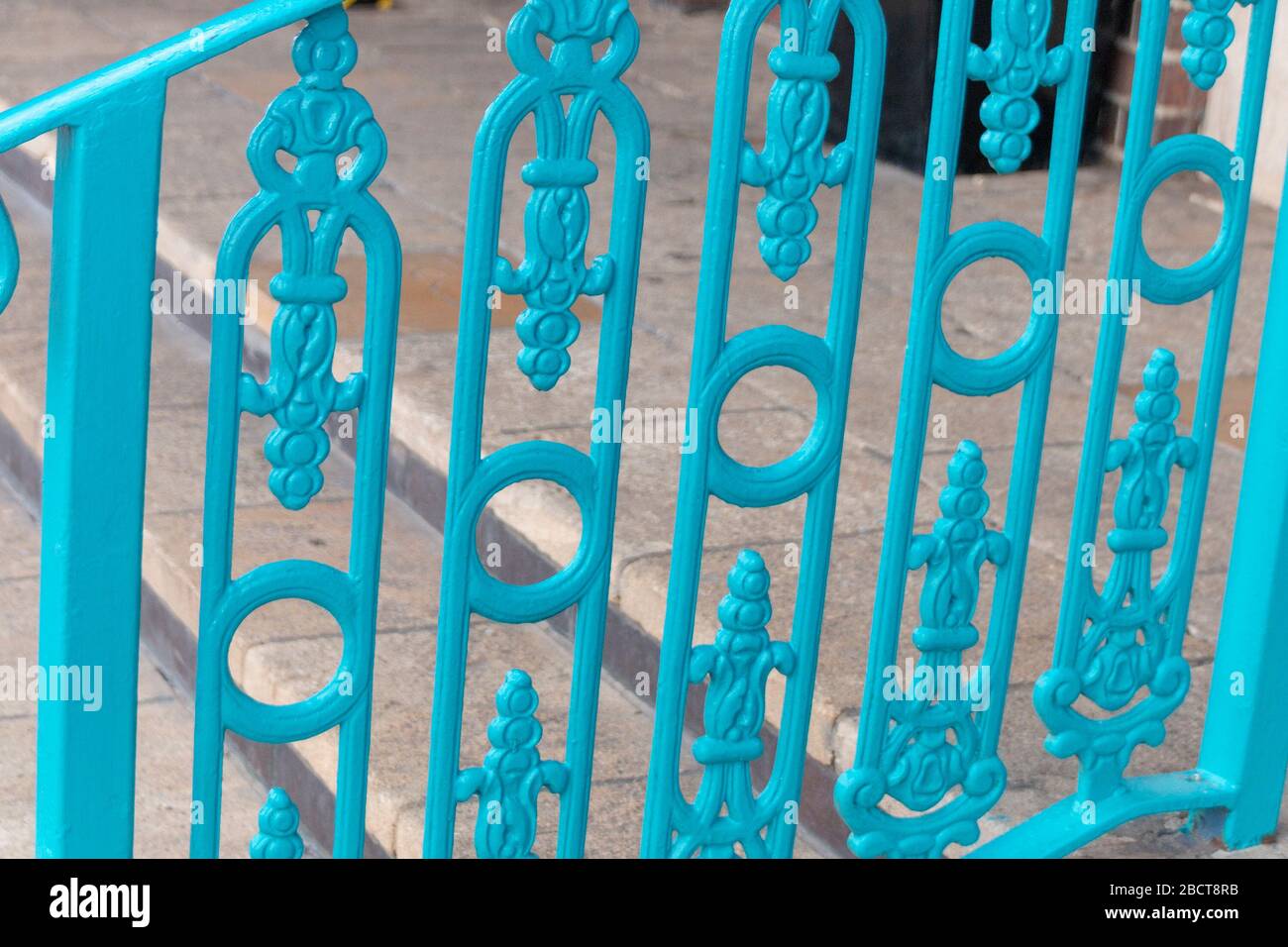 a close up view of a bright blue railing going up some stairs Stock ...