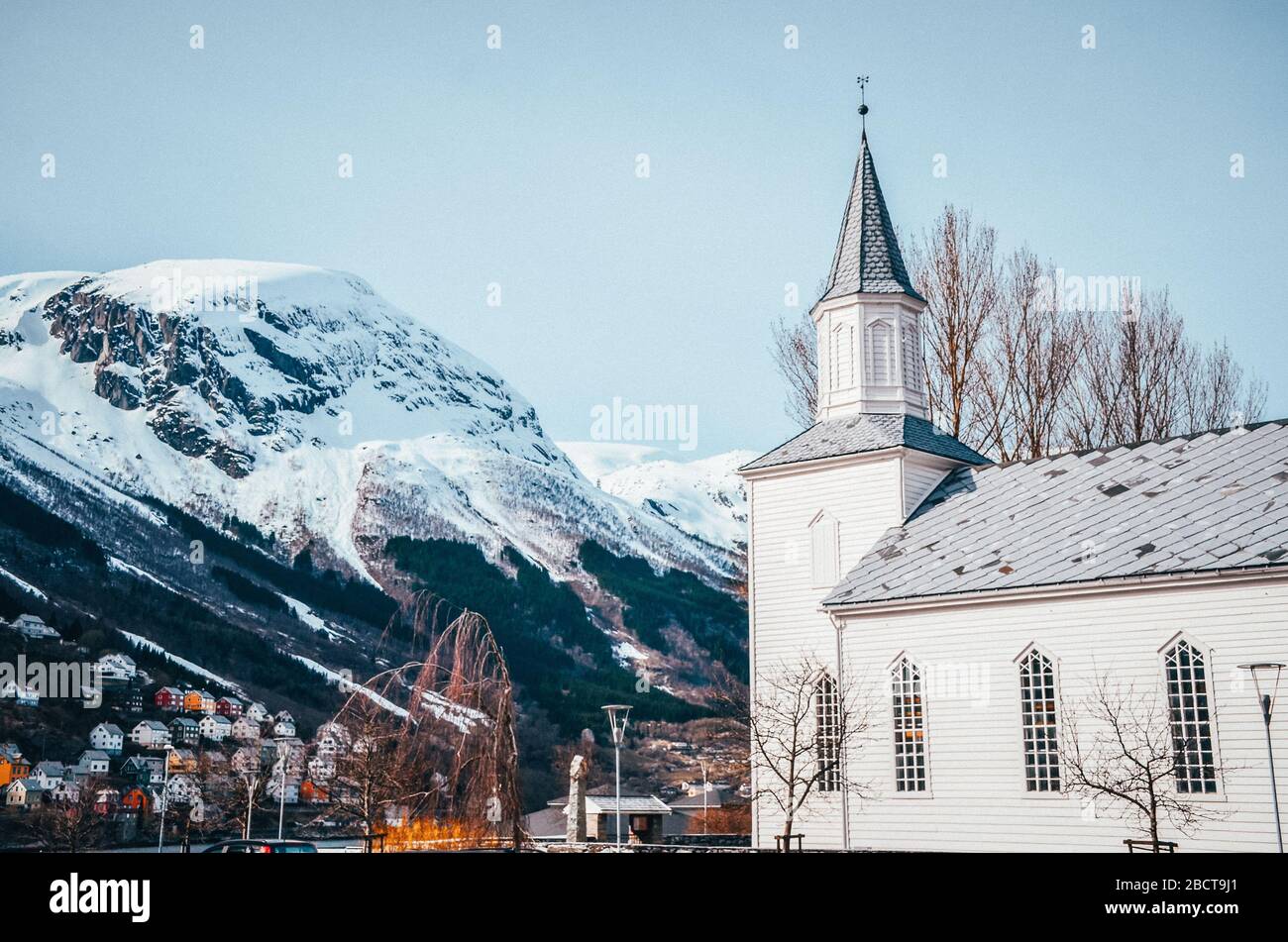 Village in Norway. Typical houses near by lake in the sharp hill ...