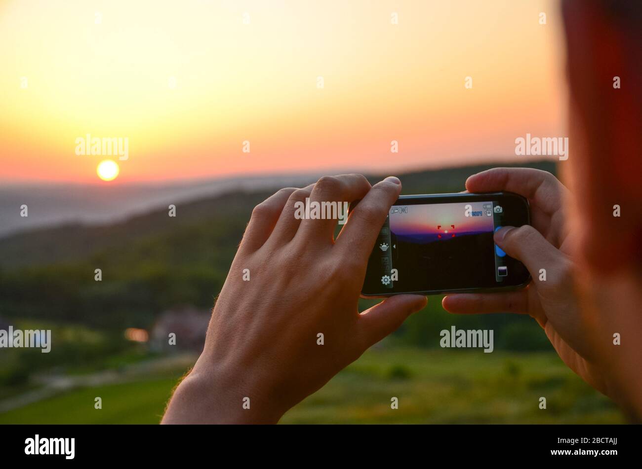 Photographing sunset on mobile hi-res stock photography and images - Alamy