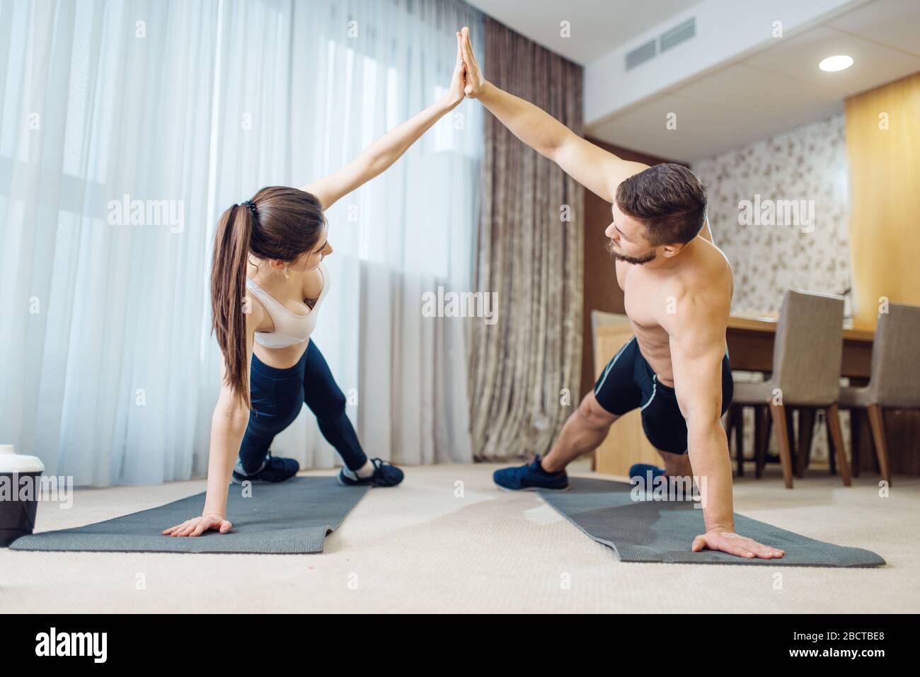 Morning fit workout of love couple at home Stock Photo - Alamy