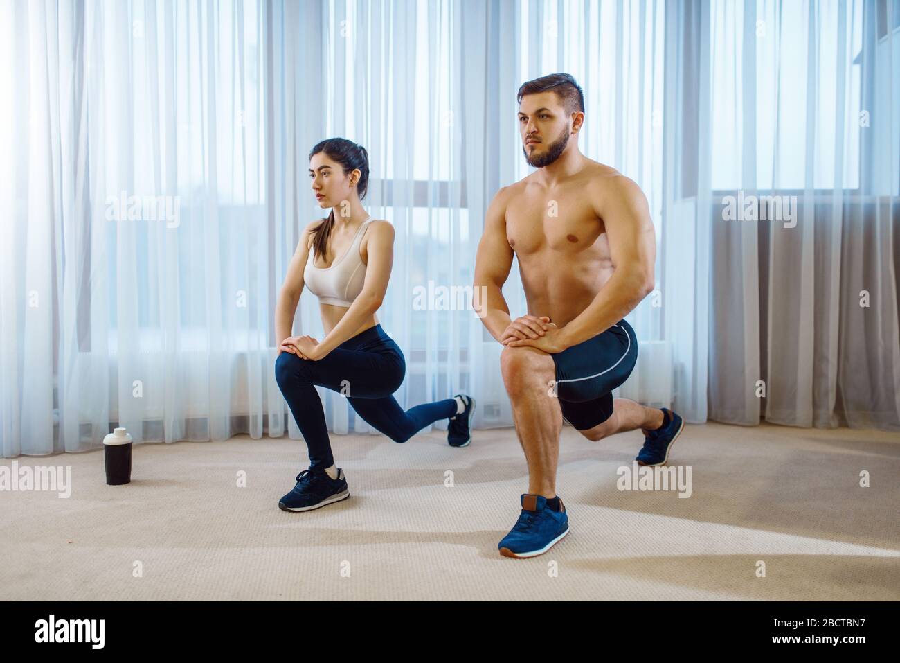 Morning fit workout of love couple at home Stock Photo - Alamy