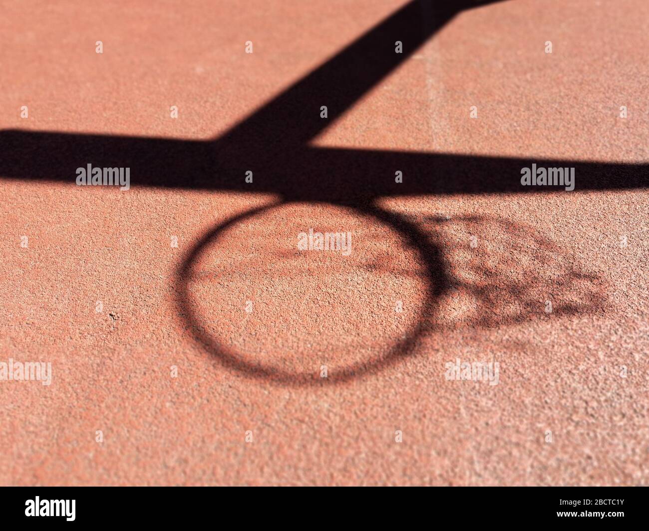 Basketball board and net shadow during the day on the basketball court ...