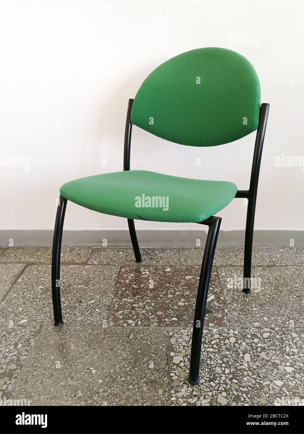 Modern green fabric office chair on the stone pattern taled floor Stock ...
