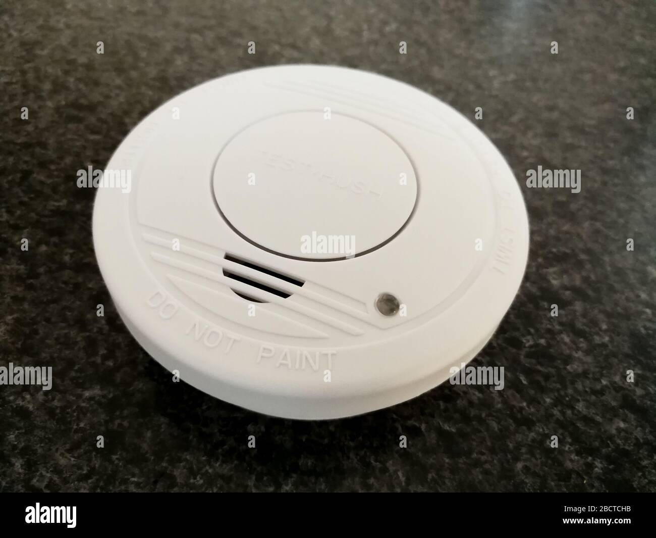 Plastic smoke alarm sensor isolated on the dark background Stock Photo ...