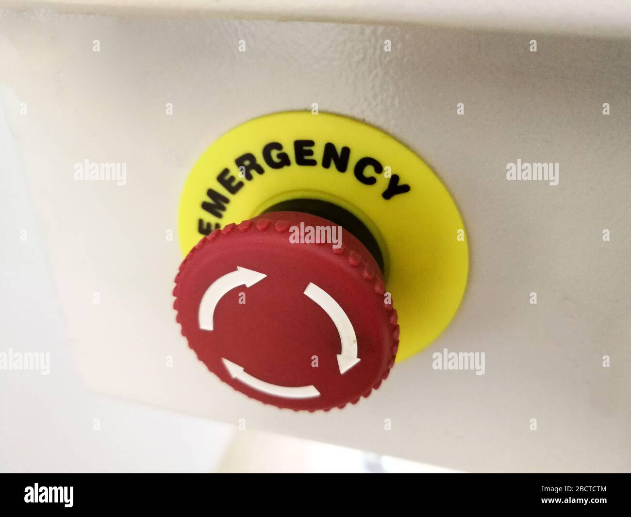 Red button on industrial machine for cancel and emergency stop of ...