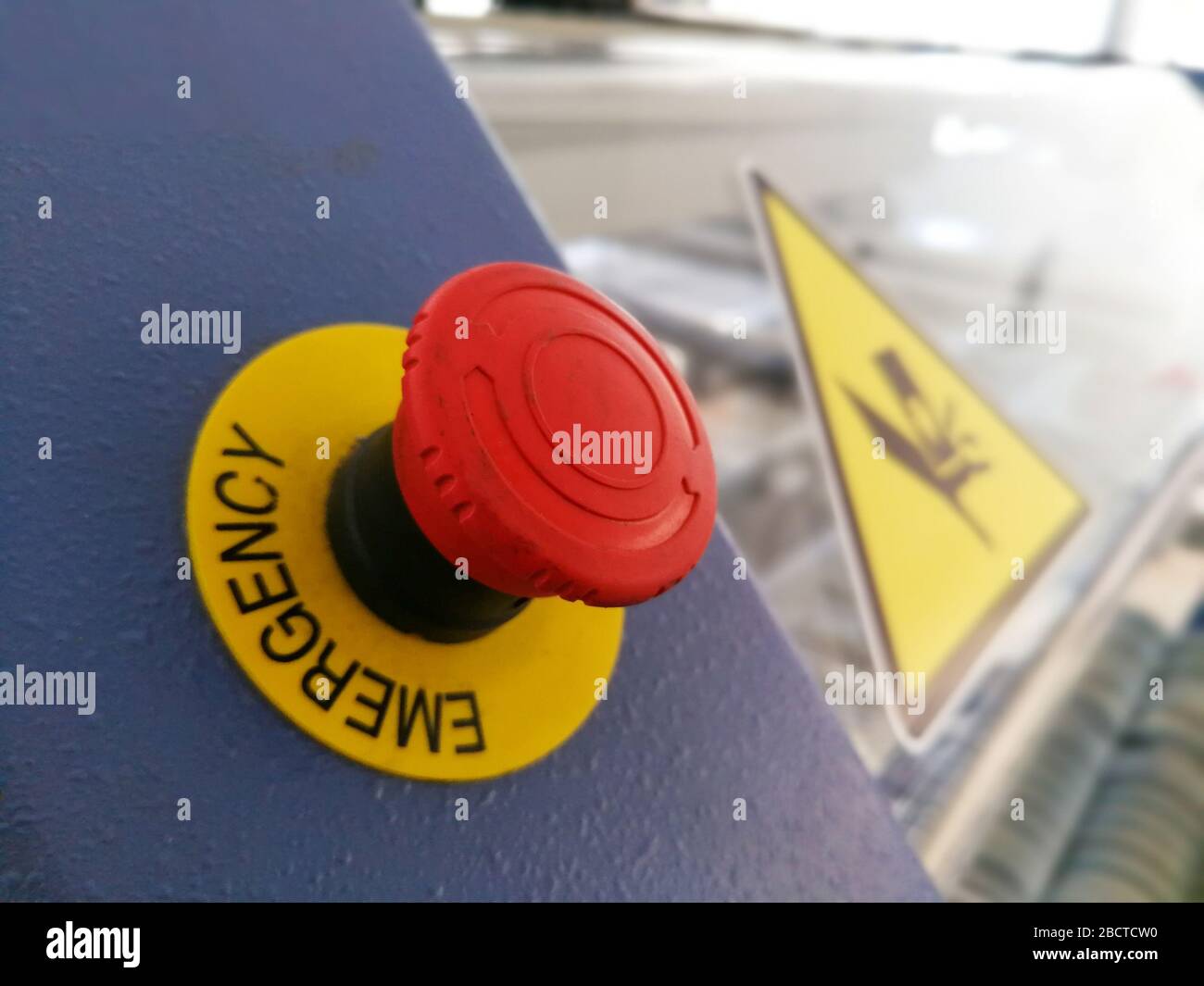 Red button on industrial machine for cancel and emergency stop of ...