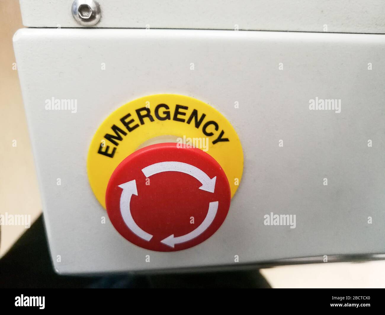 Red button on industrial machine for cancel and emergency stop of ...