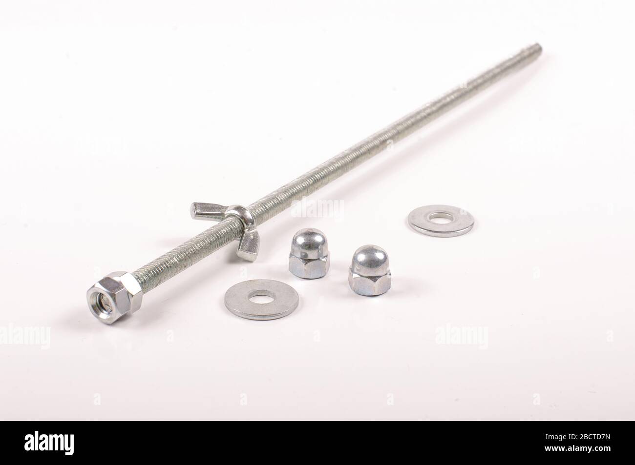 Metal rod with thread and nuts for mechanical DIY works Stock Photo - Alamy