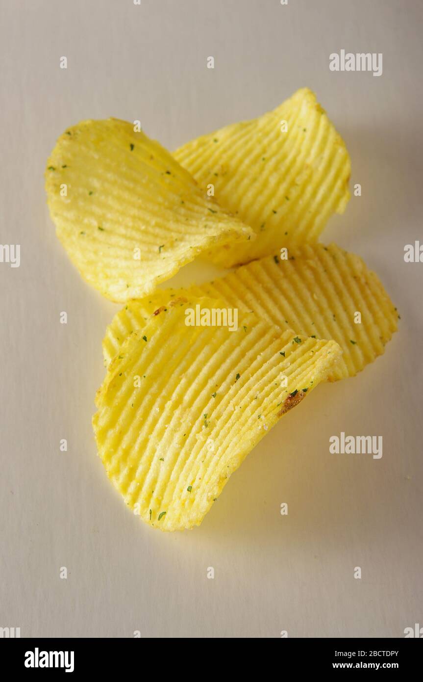 Wavy potato chips isolated on the white background Stock Photo - Alamy
