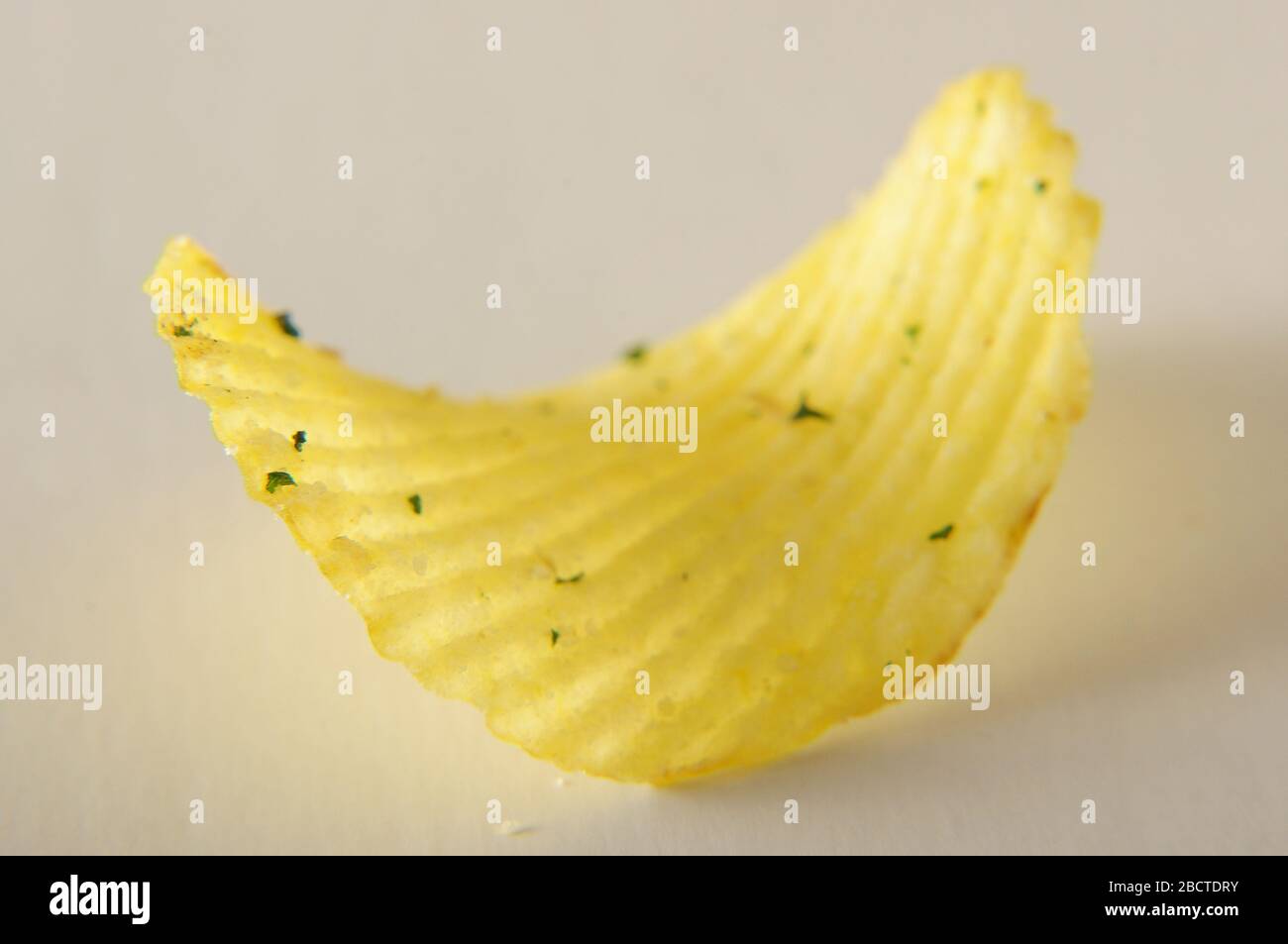Wavy potato chip isolated on the white background Stock Photo - Alamy
