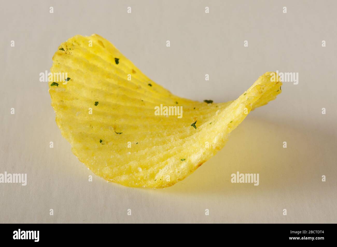 Wavy potato chip isolated on the white background Stock Photo - Alamy