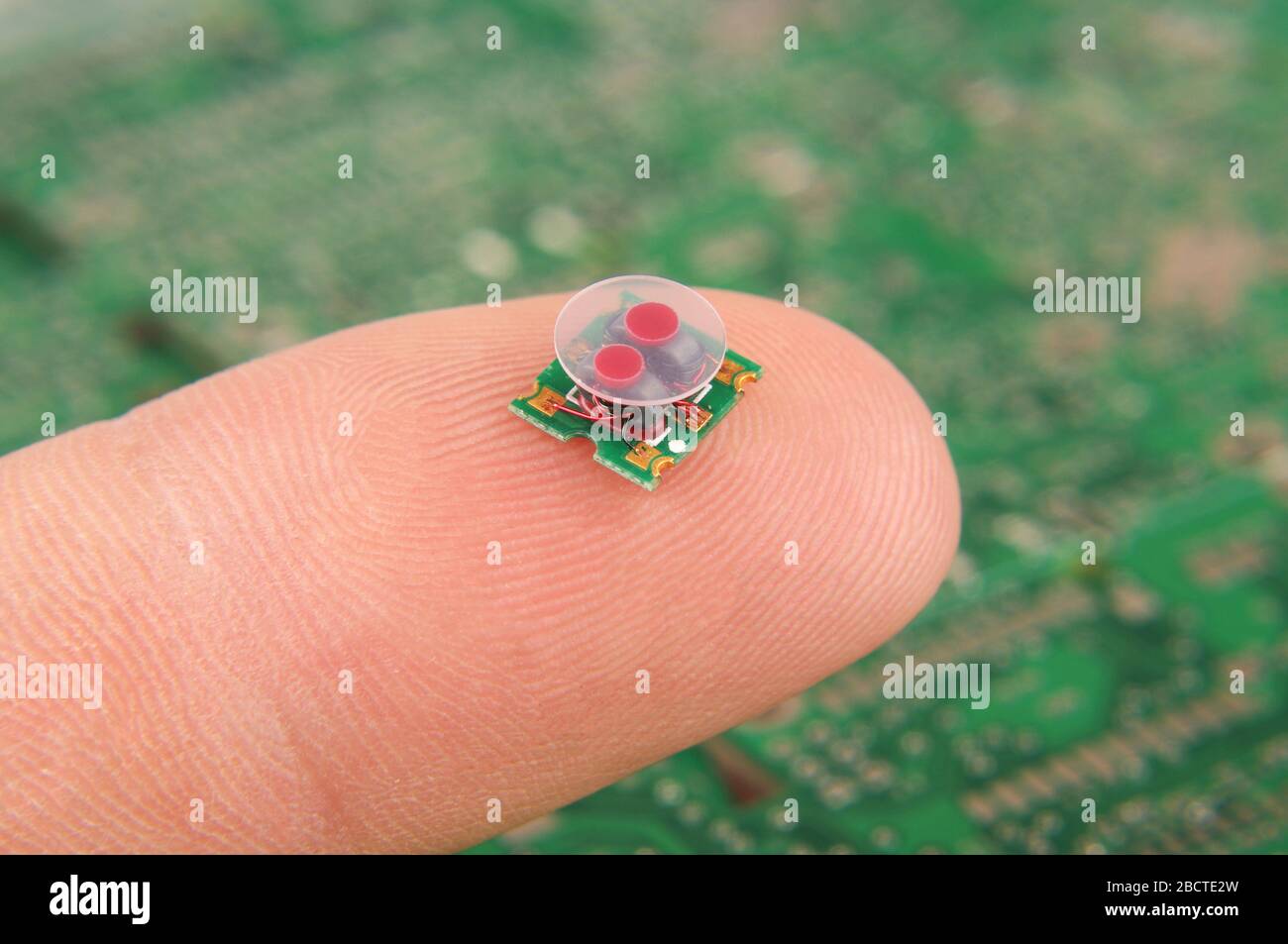 Modern electronics surface mount components in comparison to human ...
