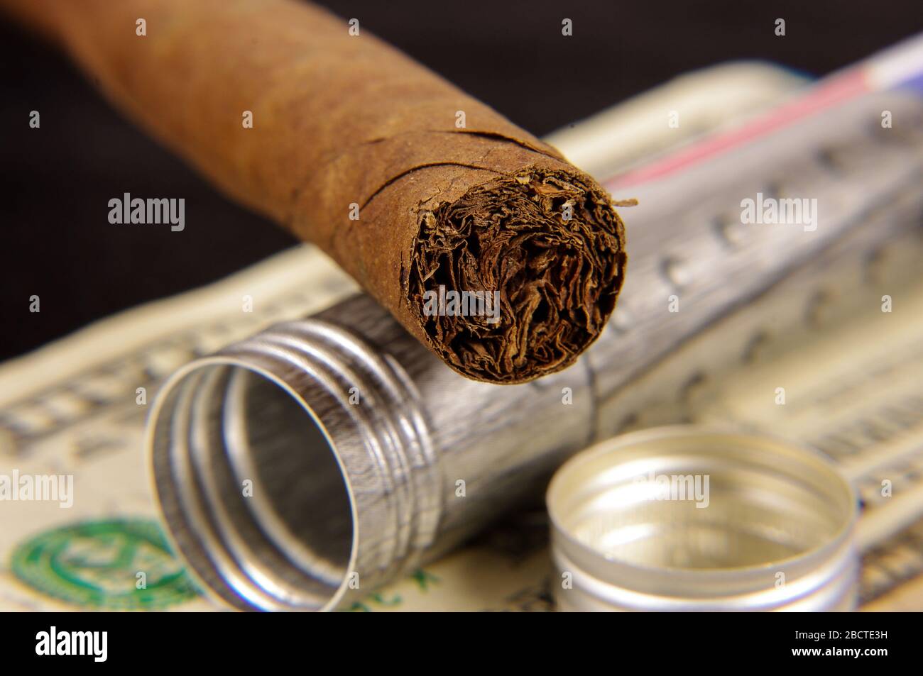 In the photo you can see expensive cigar on the dollar banknotes Stock ...