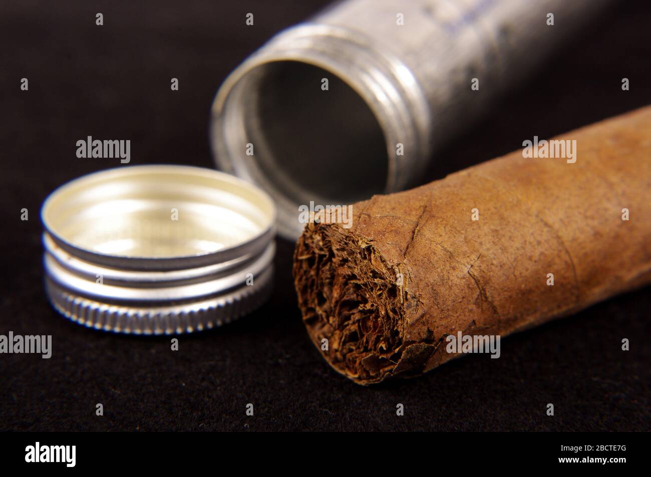 The photo in which macro closeup of cigar isolated on the black ...