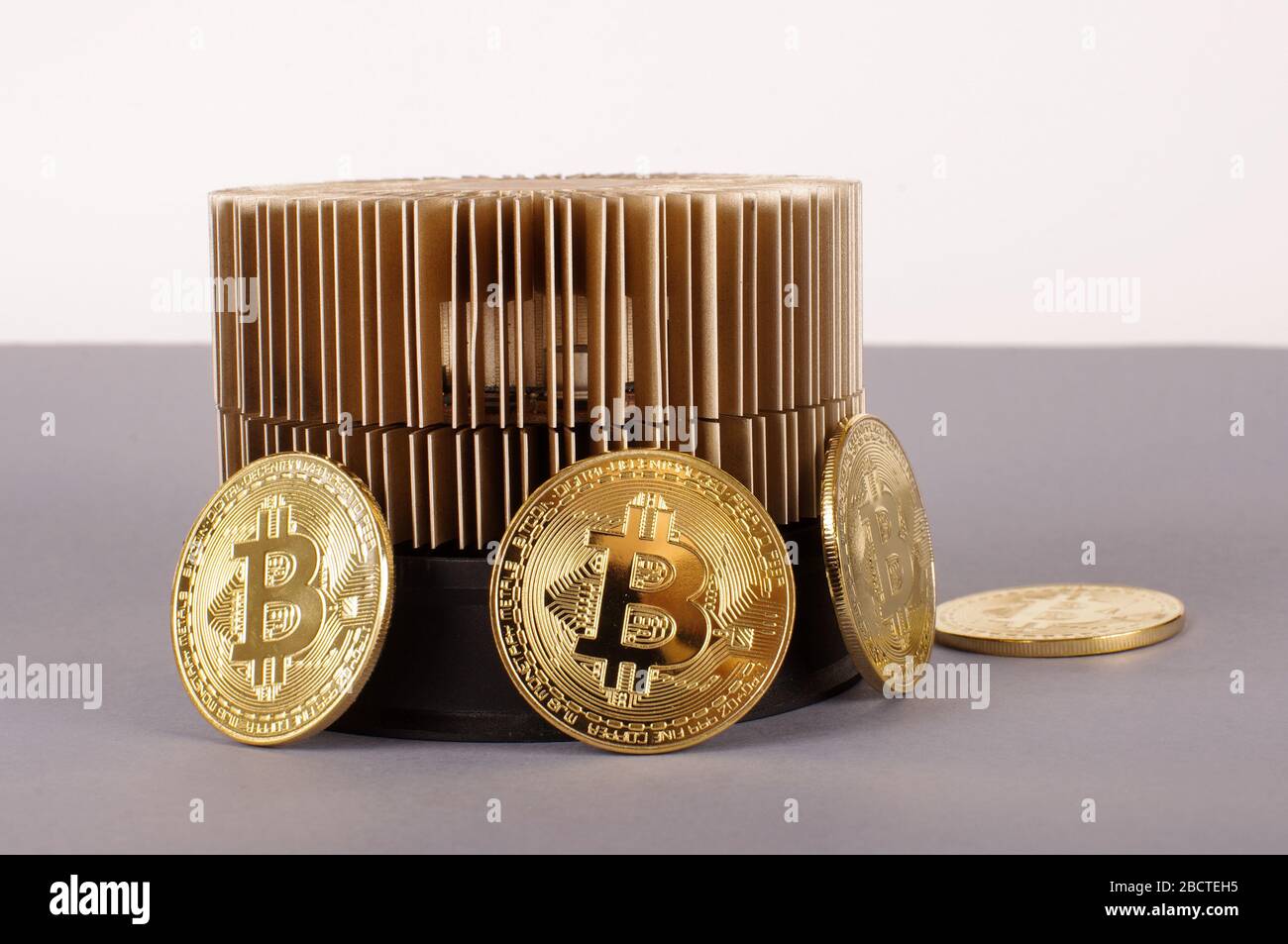 Bitcoin mining device and symbolic coins as a profit concept Stock ...