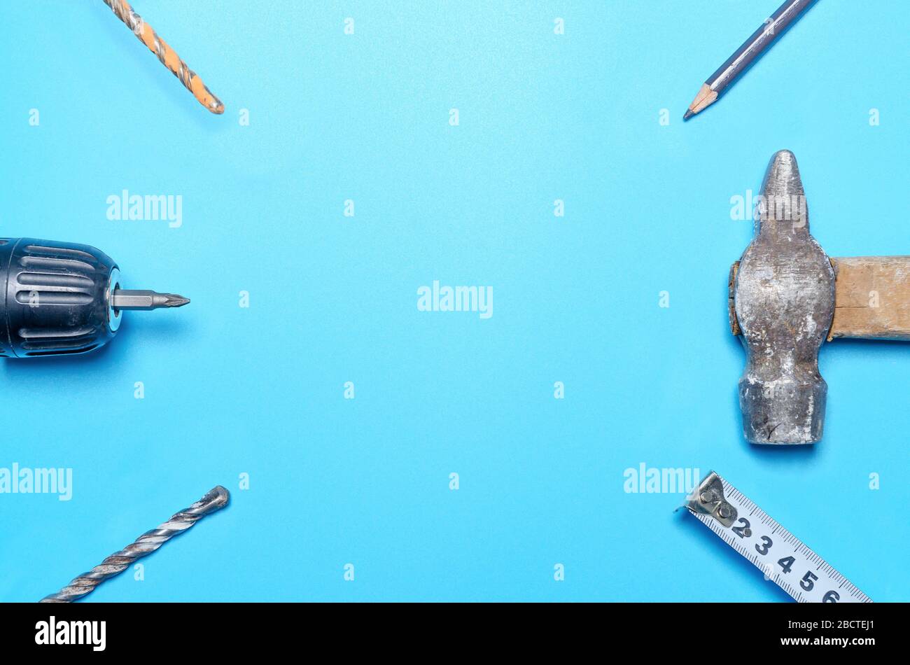 construction and repair tools, tape measure, hammer, marking pencil ...