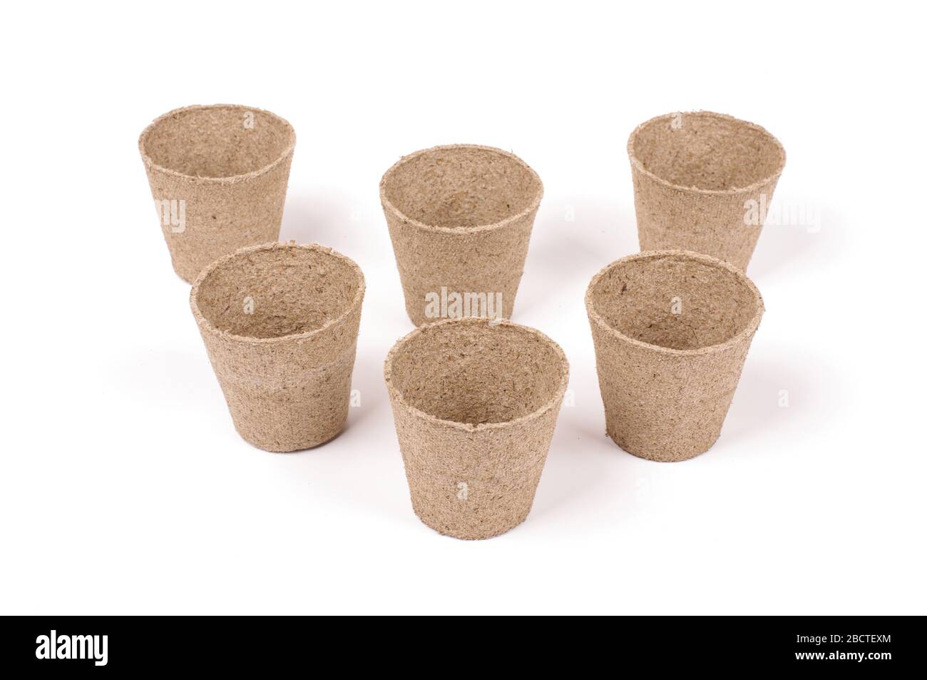 Peat pots isolated on the white background Stock Photo - Alamy