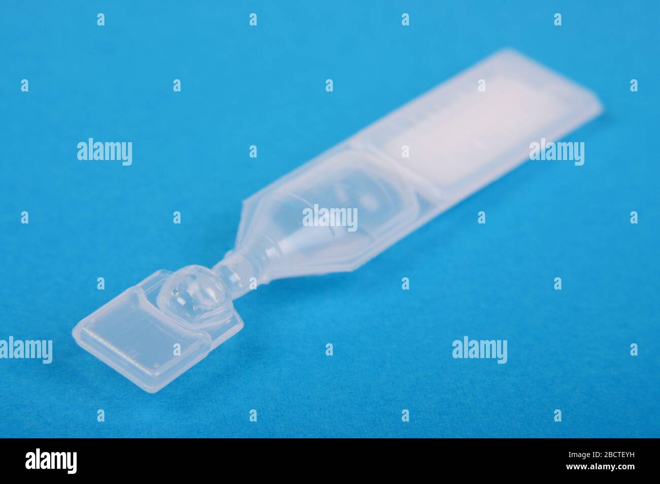 Artificial tears for dry eyes isolated on the blue background Stock ...