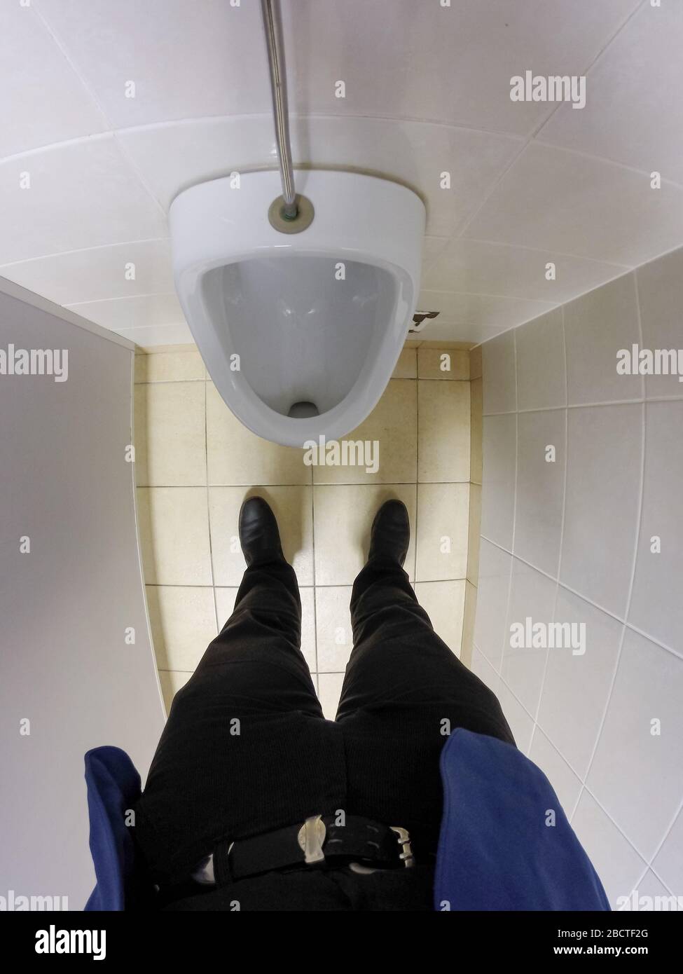 Modern office restroom interrior with businessman Stock Photo - Alamy