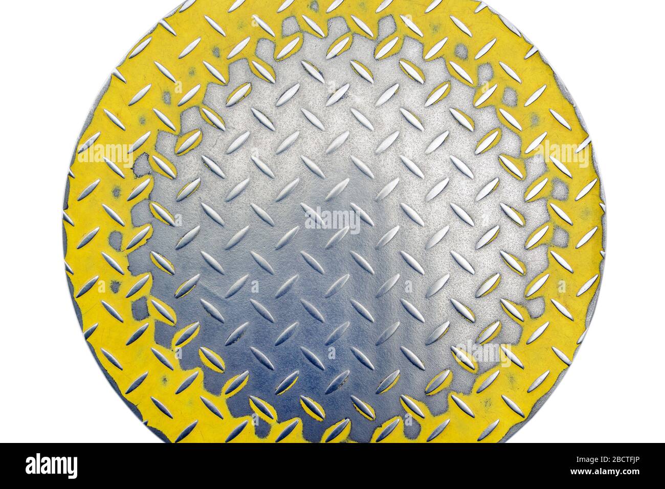 time polished metal sheet of diamond steel. yellow paint around the ...