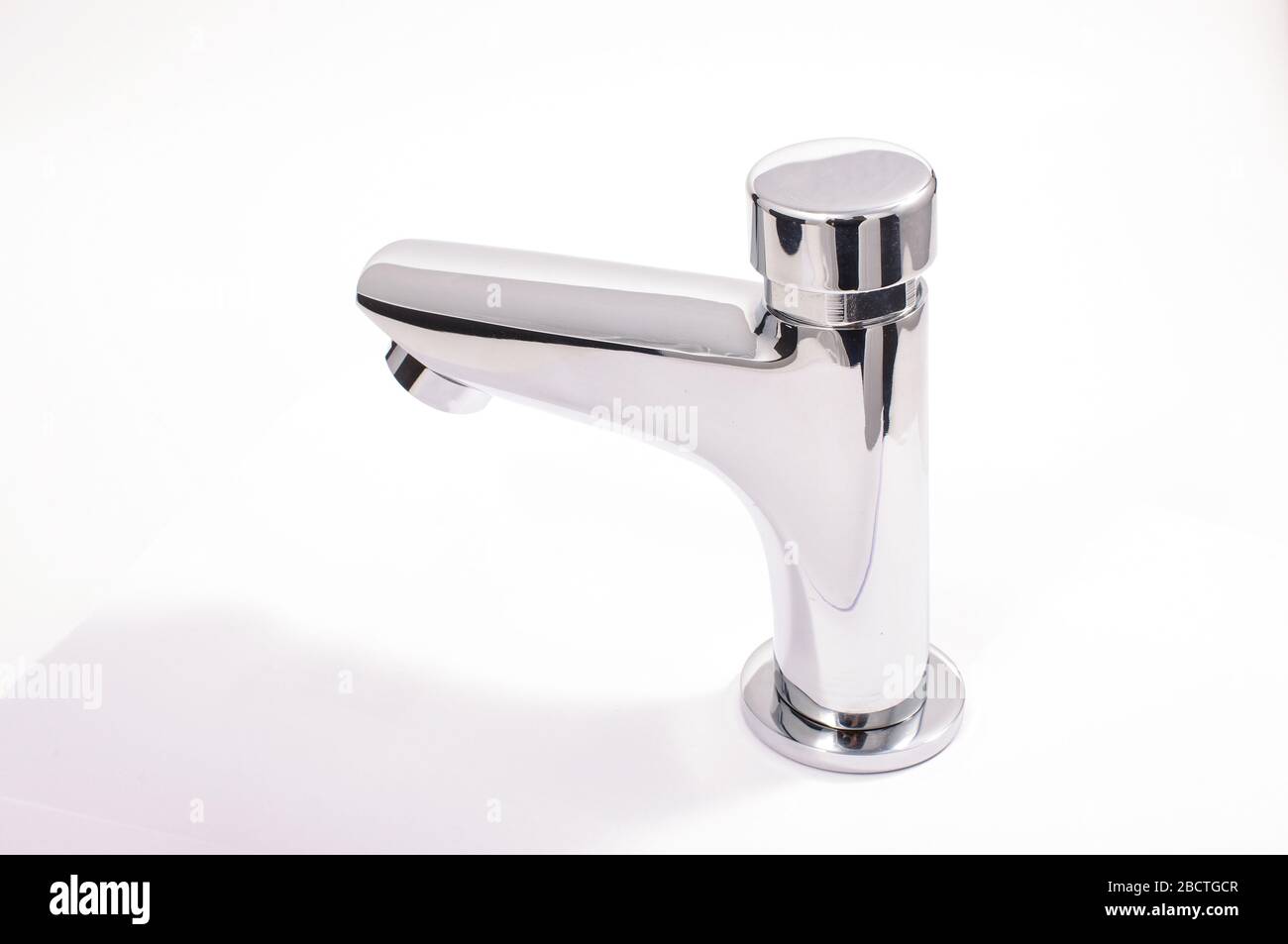 Tap on the white background Stock Photo - Alamy