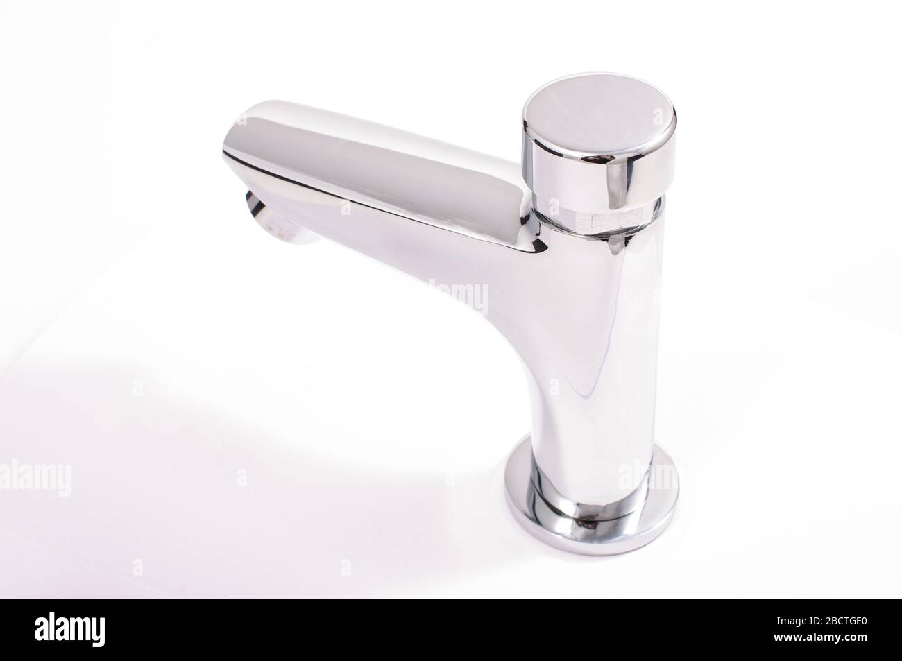 Tap on the white background Stock Photo - Alamy