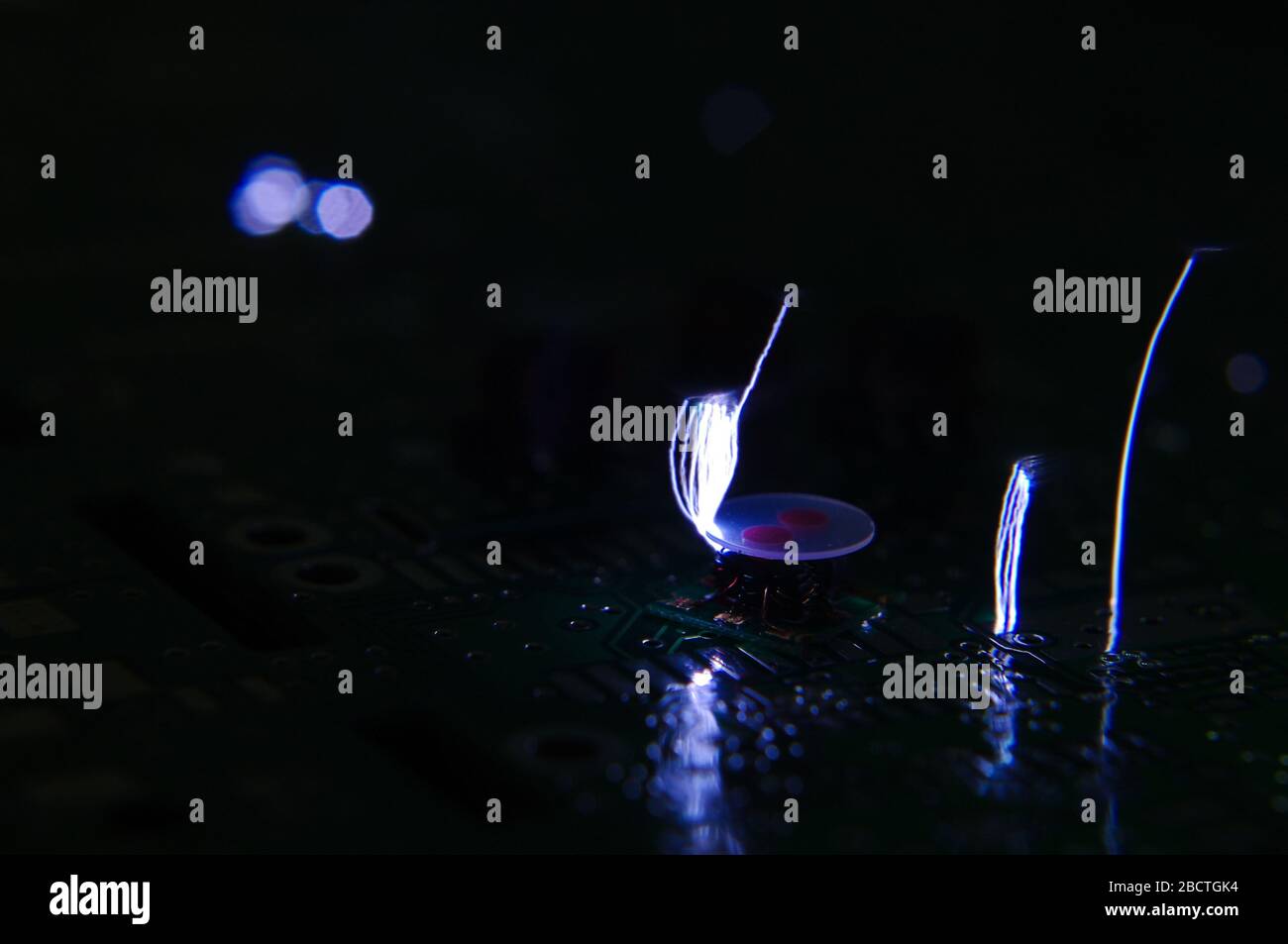 Small electrostatic lighting sparks closed to electronic components ...
