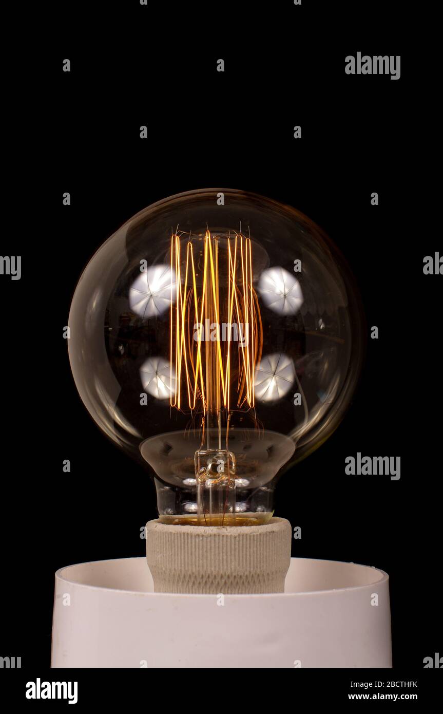 Old style light bulb with filament Stock Photo - Alamy