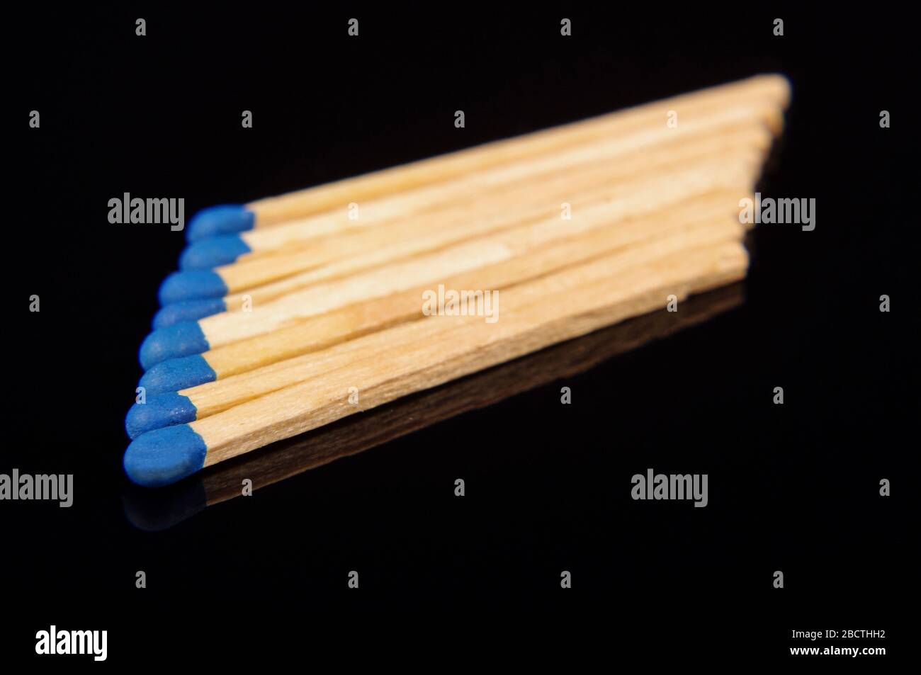 Group of matches on the dark background Stock Photo - Alamy