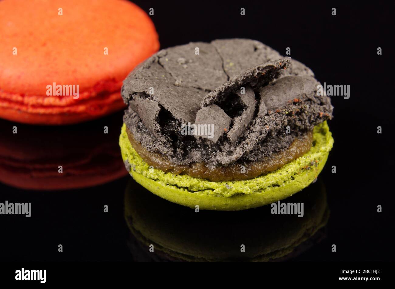 Broken french macaron. Popular biscuit Stock Photo - Alamy