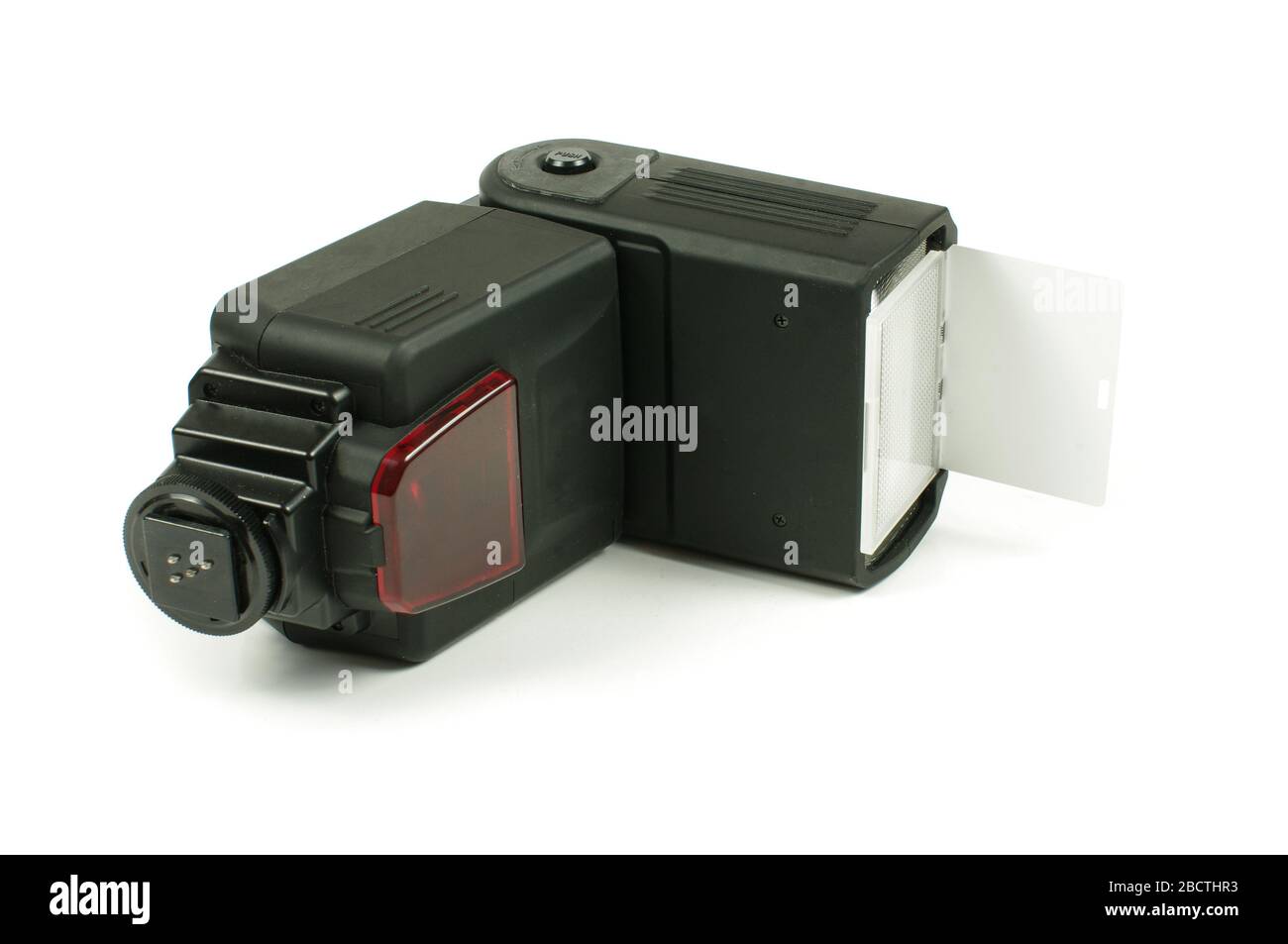 External DSLR photo camera flash called speedlight on the white ...