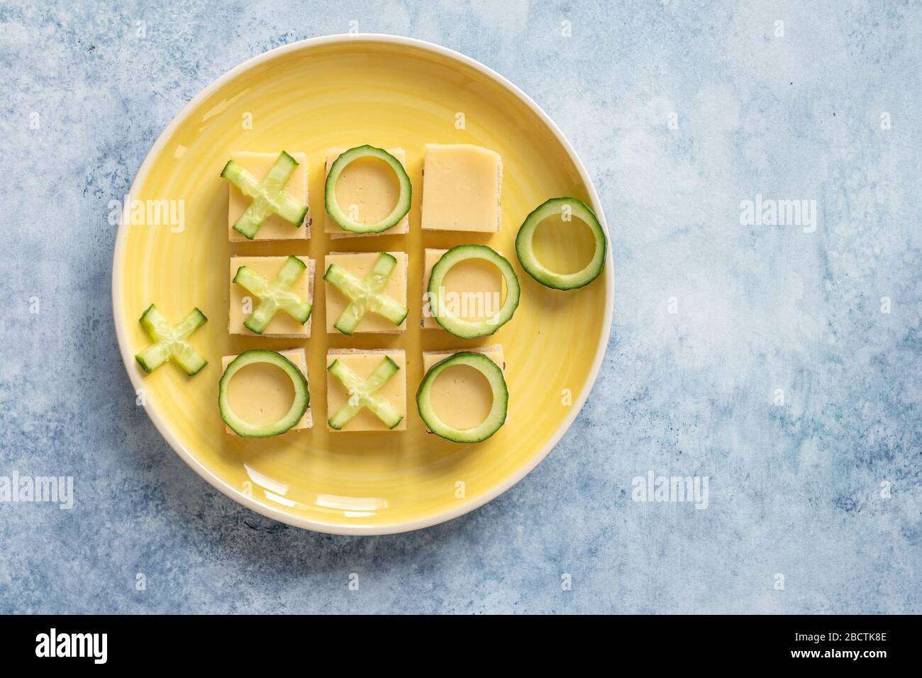 Tic tac toe sandwich. Fresh bread, cheese and cucumber Stock Photo - Alamy