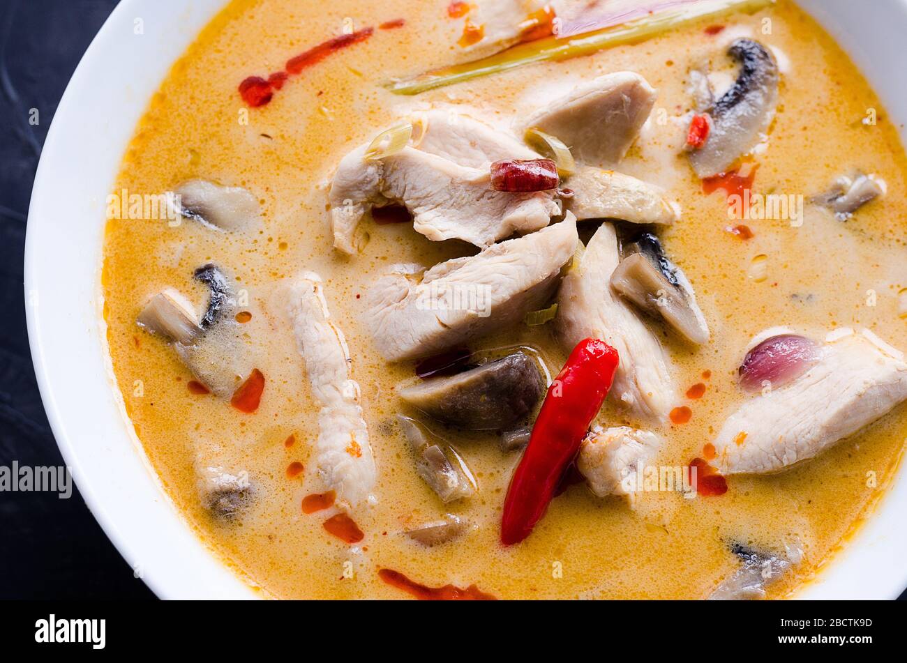 Tom Kha Kai soup with mushrooms, Thai dish Stock Photo - Alamy