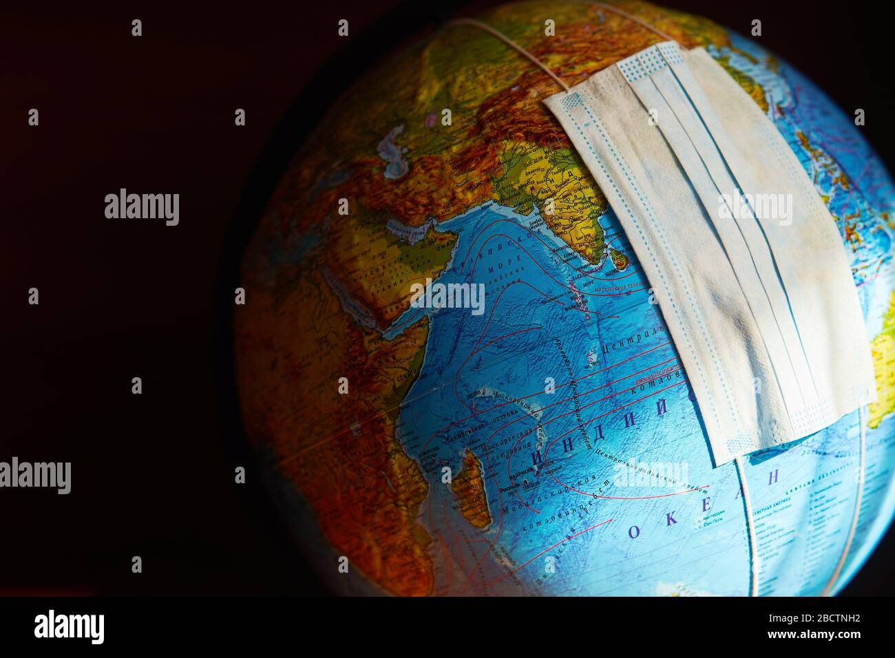 Medical mask on the globe. Disease Prevention. Surgical Face Mask and ...