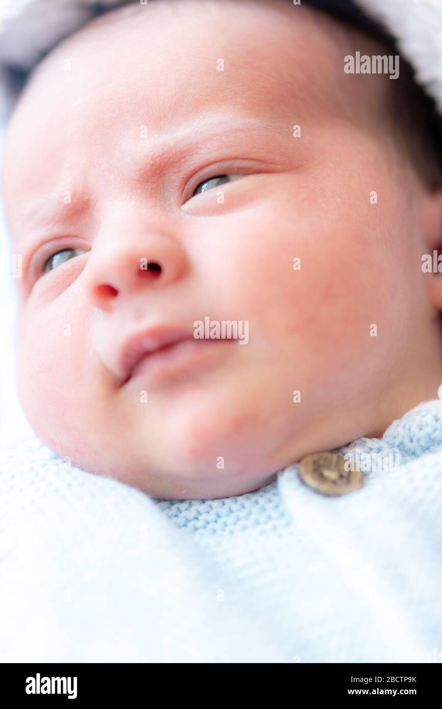 Close up portrait of a newborn baby. Close-up face of newborn baby with ...