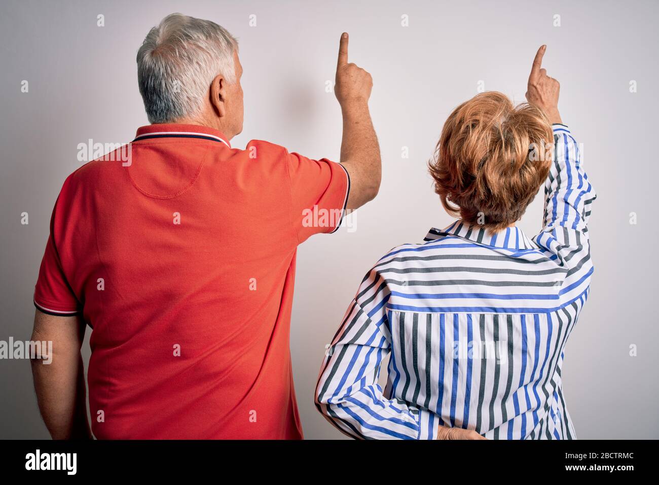 Senior beautiful couple standing together over isolated white ...
